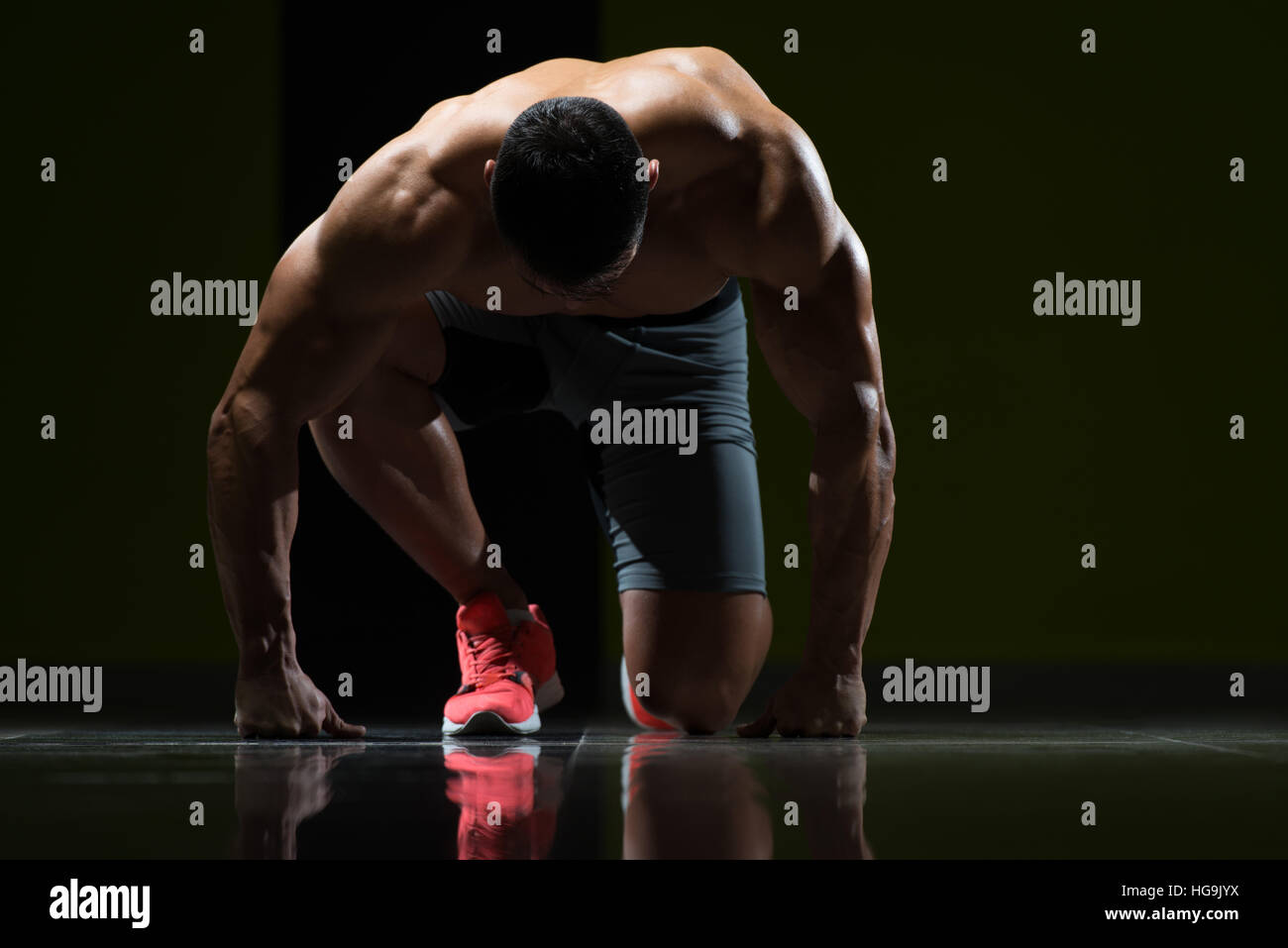Strong muscular men kneeling on hi-res stock photography and images - Alamy