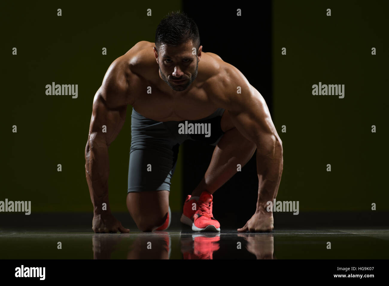 Strong muscular men kneeling on hi-res stock photography and images - Alamy