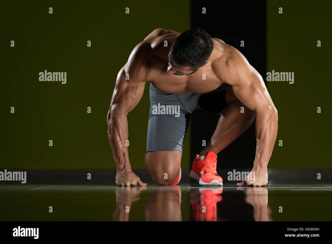Strong muscular men kneeling on hi-res stock photography and images - Alamy