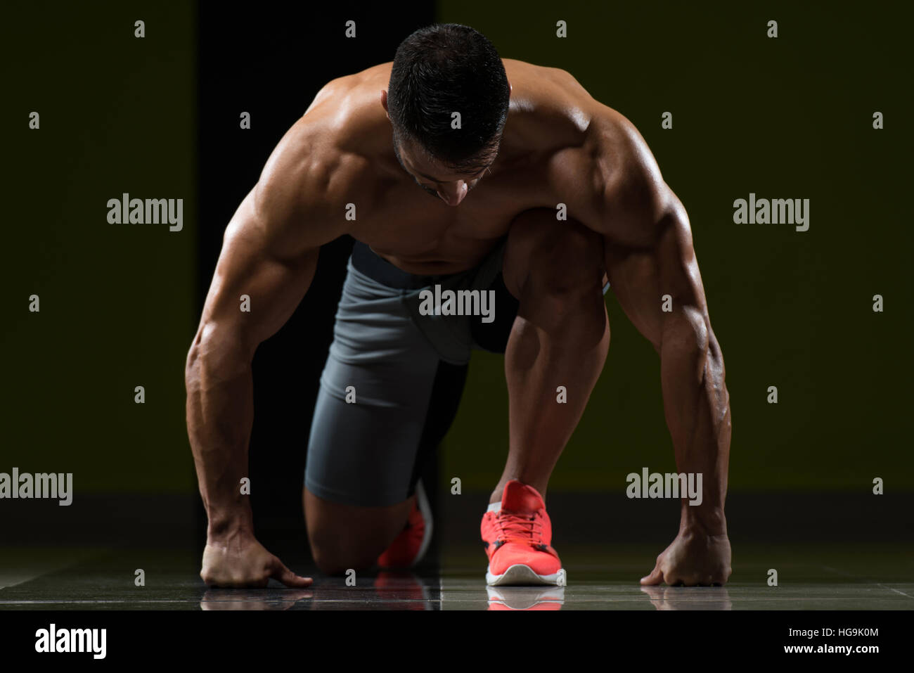 Strong muscular men kneeling on hi-res stock photography and images - Alamy