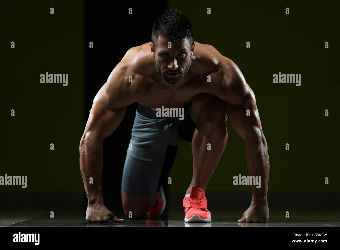 Strong muscular men kneeling on hi-res stock photography and images - Alamy