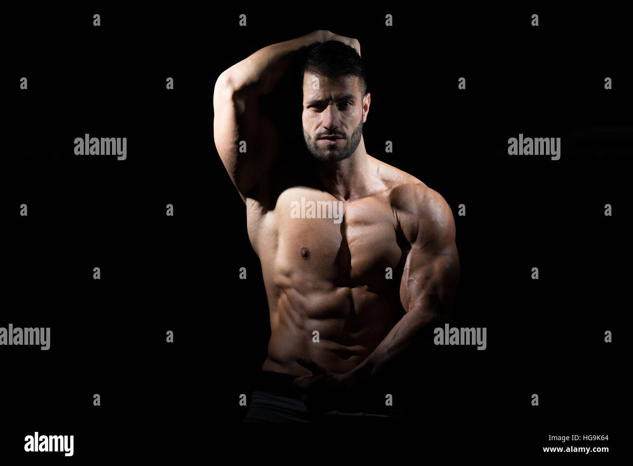 Healthy Man Standing Strong In The Gym And Flexing Muscles - Muscular ...