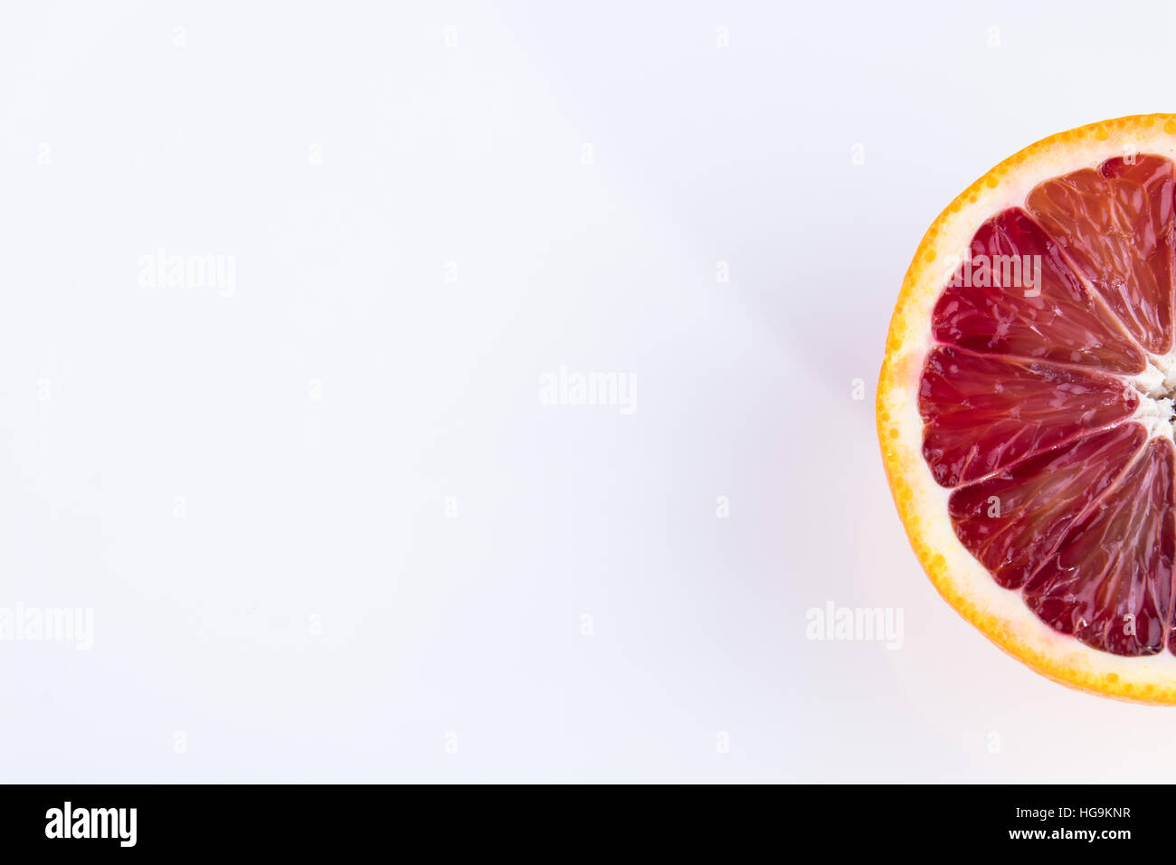 Single half of a blood orange isolated on a white background Stock ...