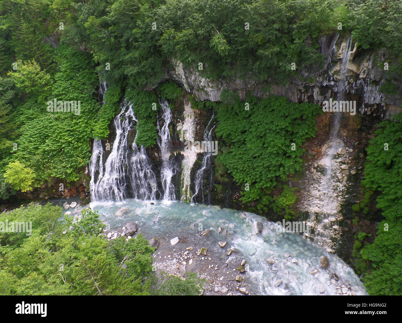 Shirahige Waterfalls and the Blue River in Biei, Hokkaido, Japan Stock ...