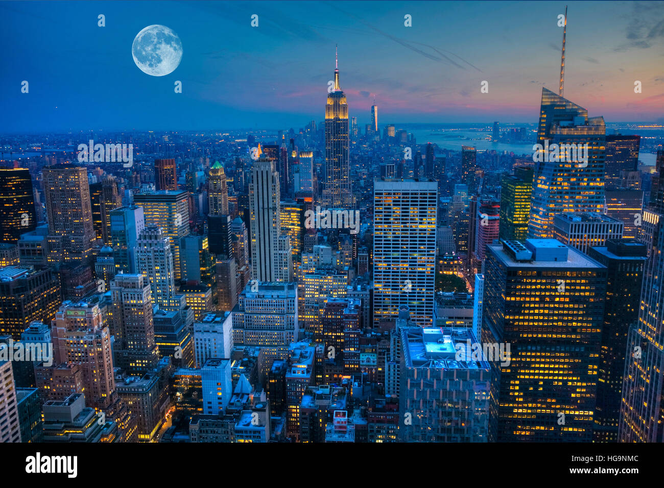 Full moon rising over Manhattan Stock Photo - Alamy