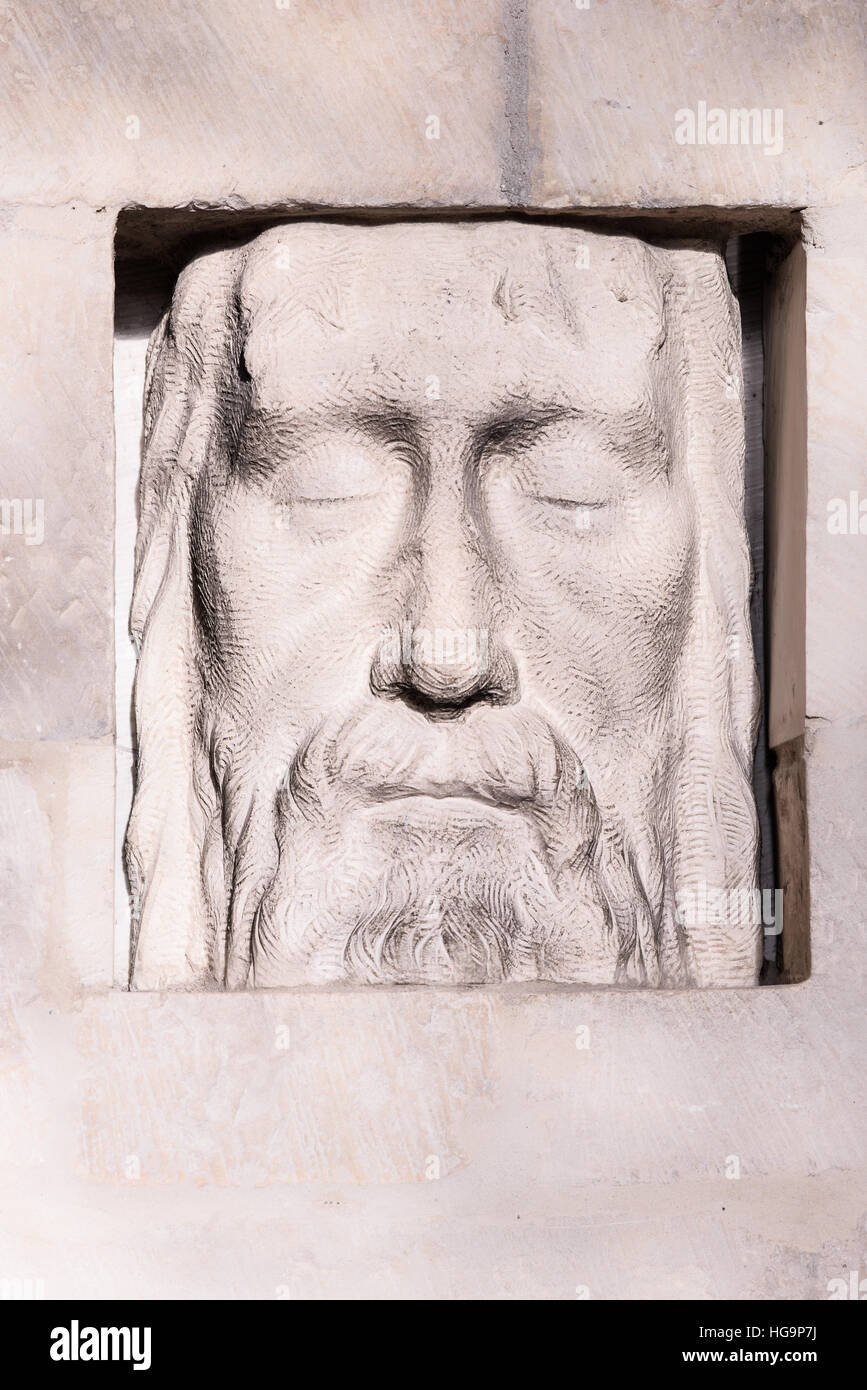 Stone carving of Jesus Christ on the side wall of a chapel at Lincoln ...