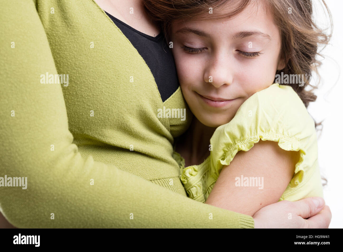 girl embraced in a protecting hug by her loving parent Stock Photo - Alamy