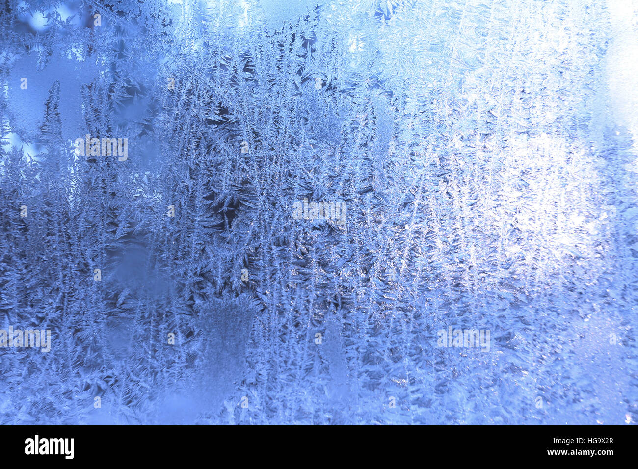 Frost patterns rise up on windows during icy temperatures in winter ...