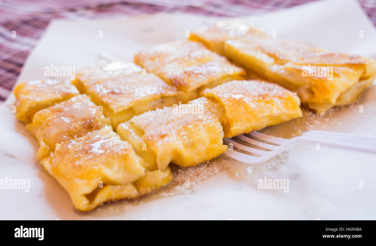 Dessert style of fried Roti with banana cooking on the street in ...