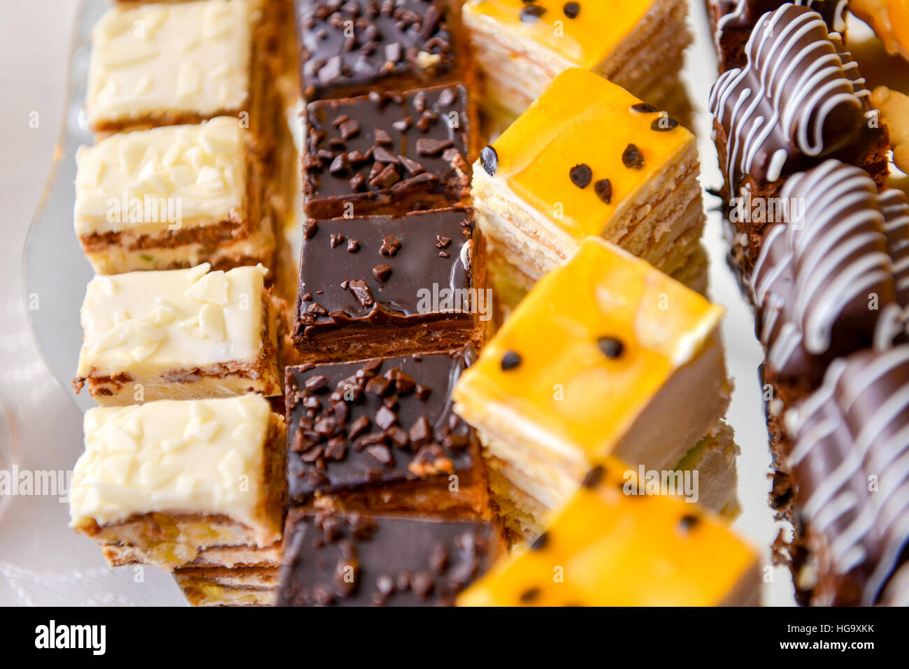 Tray with assorted cakes on the table Stock Photo - Alamy