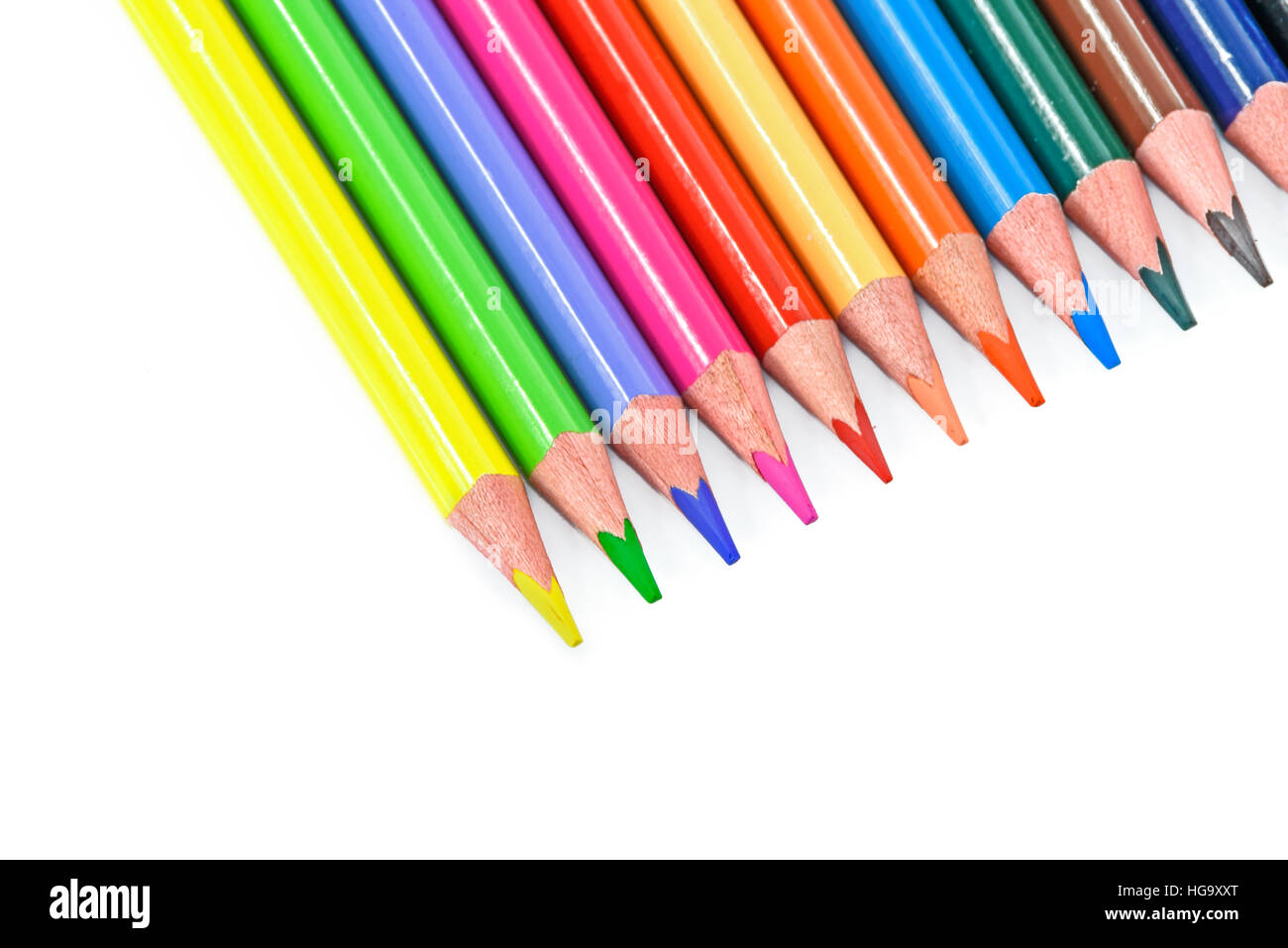 Colored pencils arranged by rainbow isolated on a white background ...