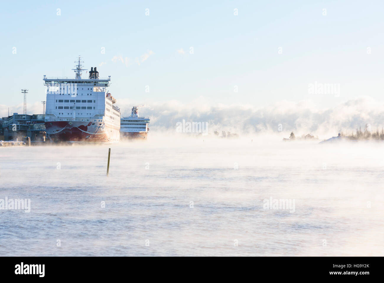 Two cruise ships in a cold steaming sea Stock Photo - Alamy