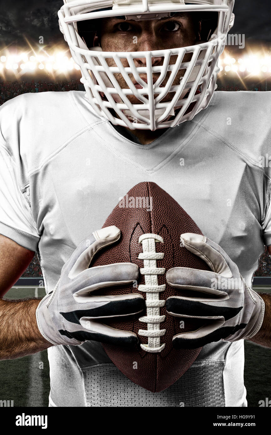 Close up of a Football Player with a white uniform on a stadium Stock ...