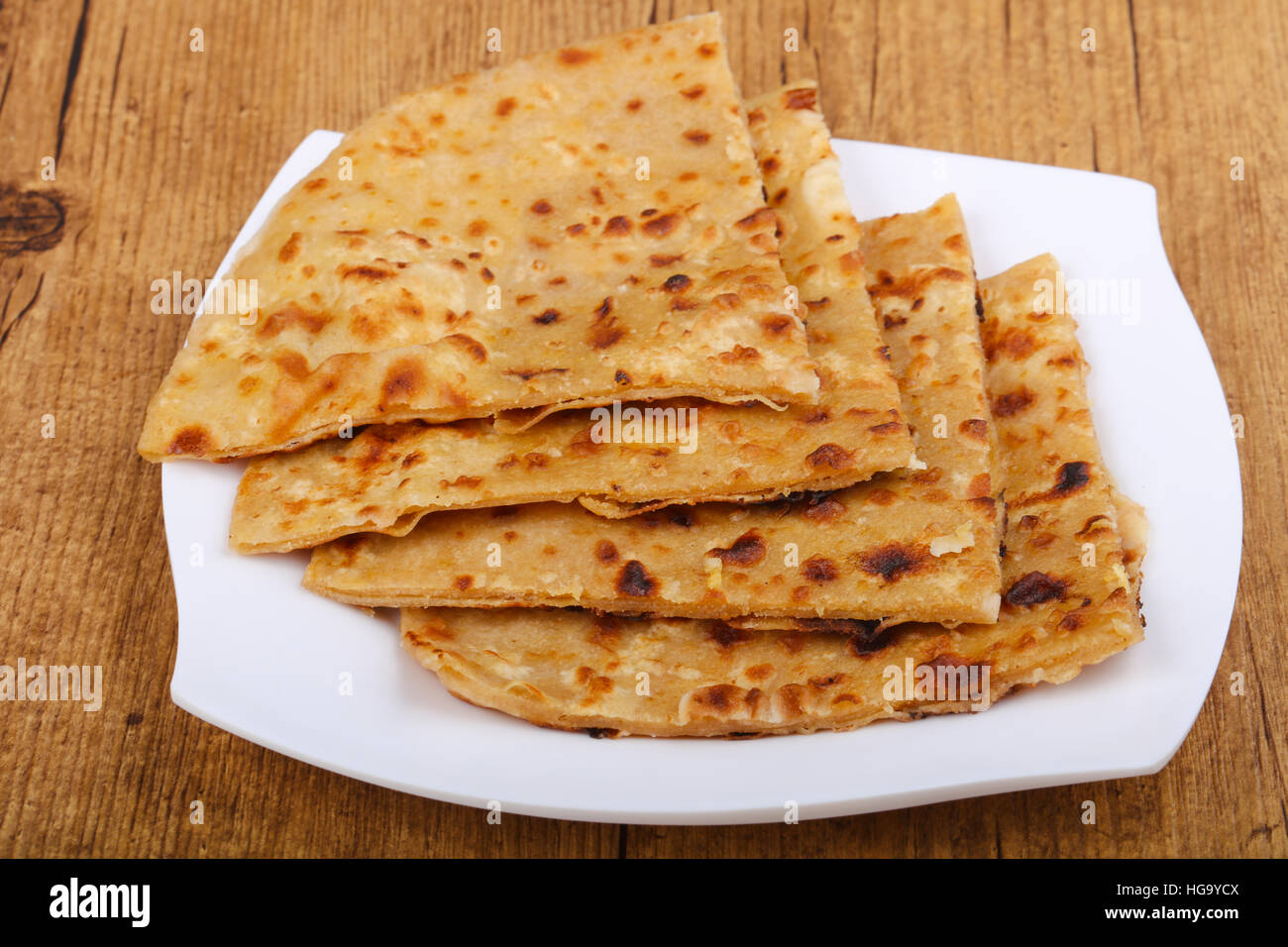 Indian bread roti on the plate in wood background Stock Photo - Alamy