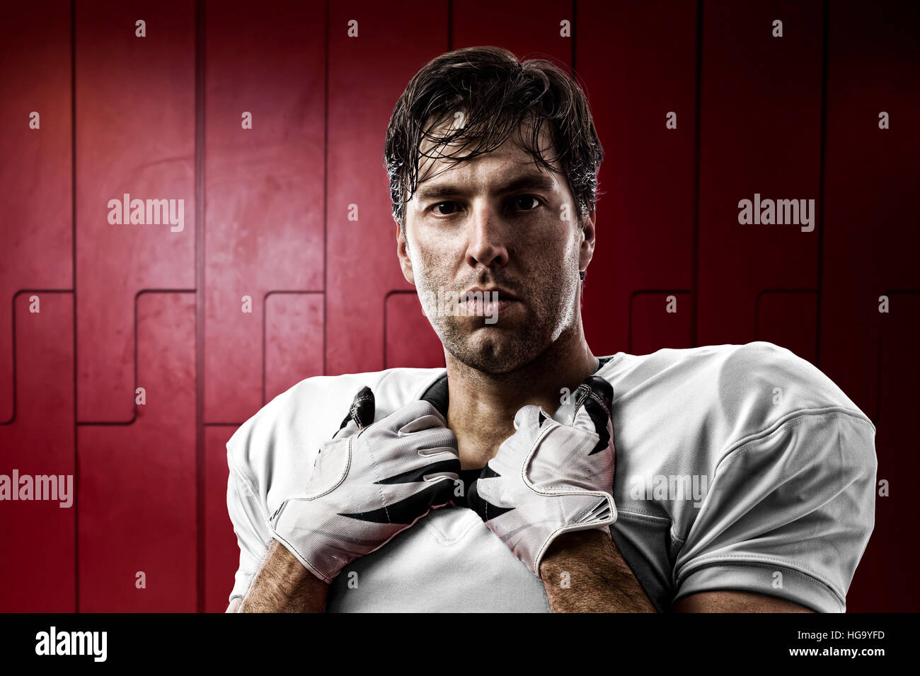 Football Player with a white uniform on a Locker roon Stock Photo - Alamy