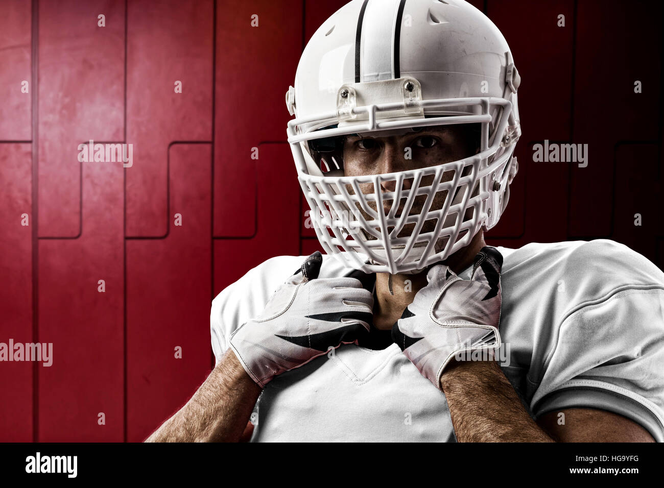 Football Player with a white uniform on a Locker roon Stock Photo - Alamy