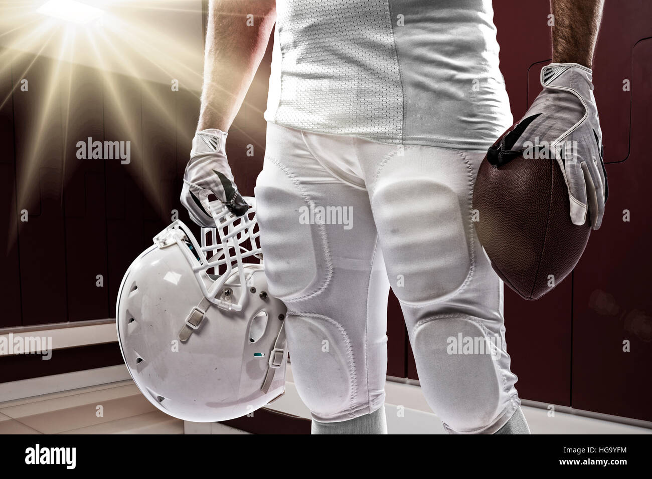 Football Player with a white uniform on a Locker roon Stock Photo - Alamy