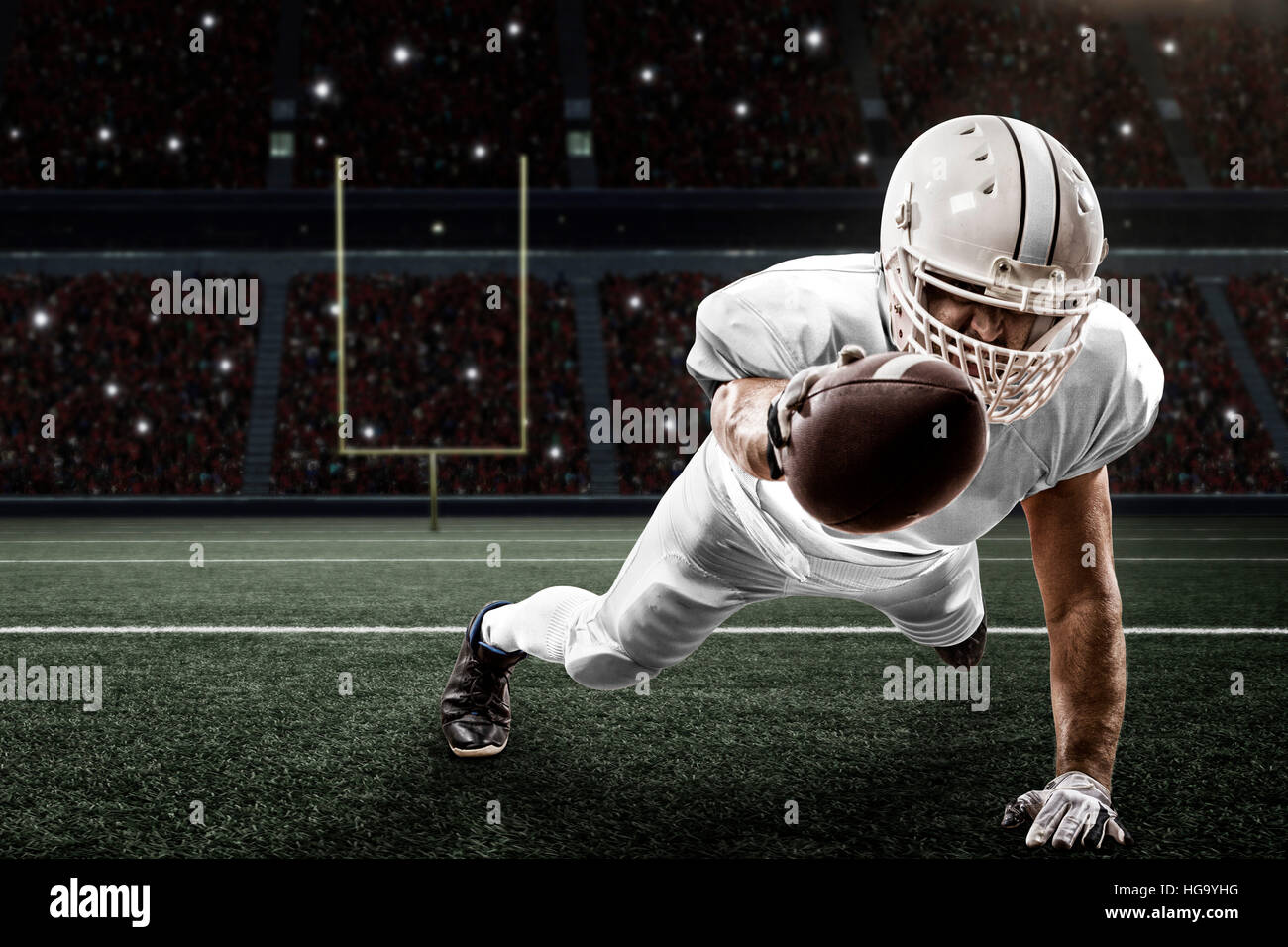 Football Player with a white uniform scoring on a Stadium Stock Photo ...