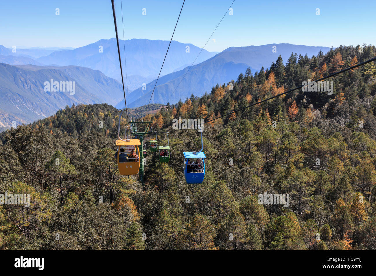 Lijiang, China - November 11, 2016: Cable Car on foreground with some ...