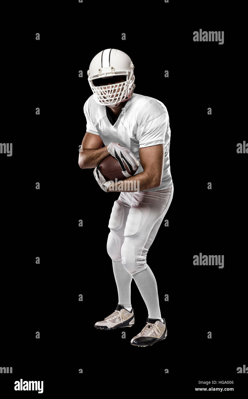 Football Player with a white uniform on a black background Stock Photo ...