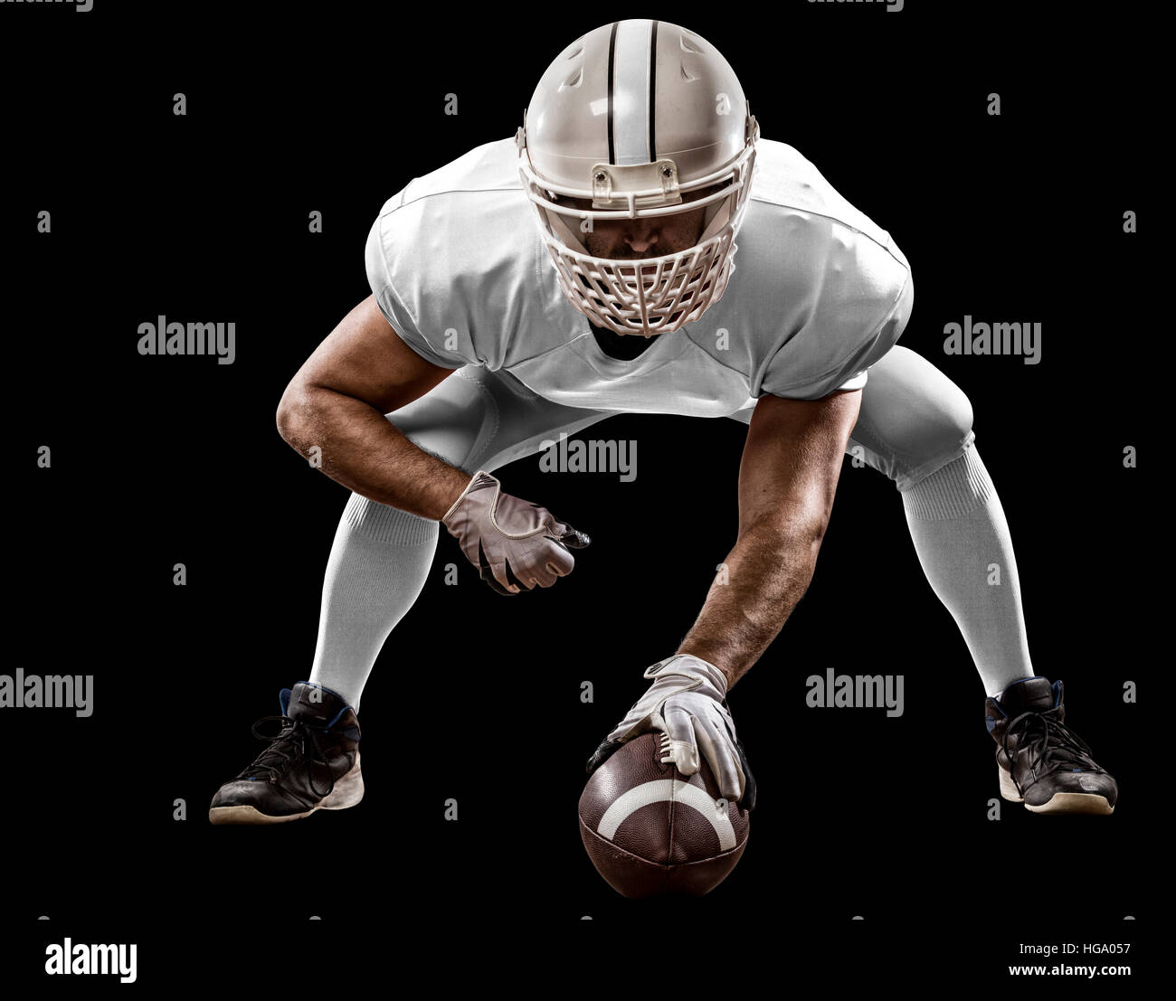 Football Player with a white uniform on the scrimmage line, on a black ...