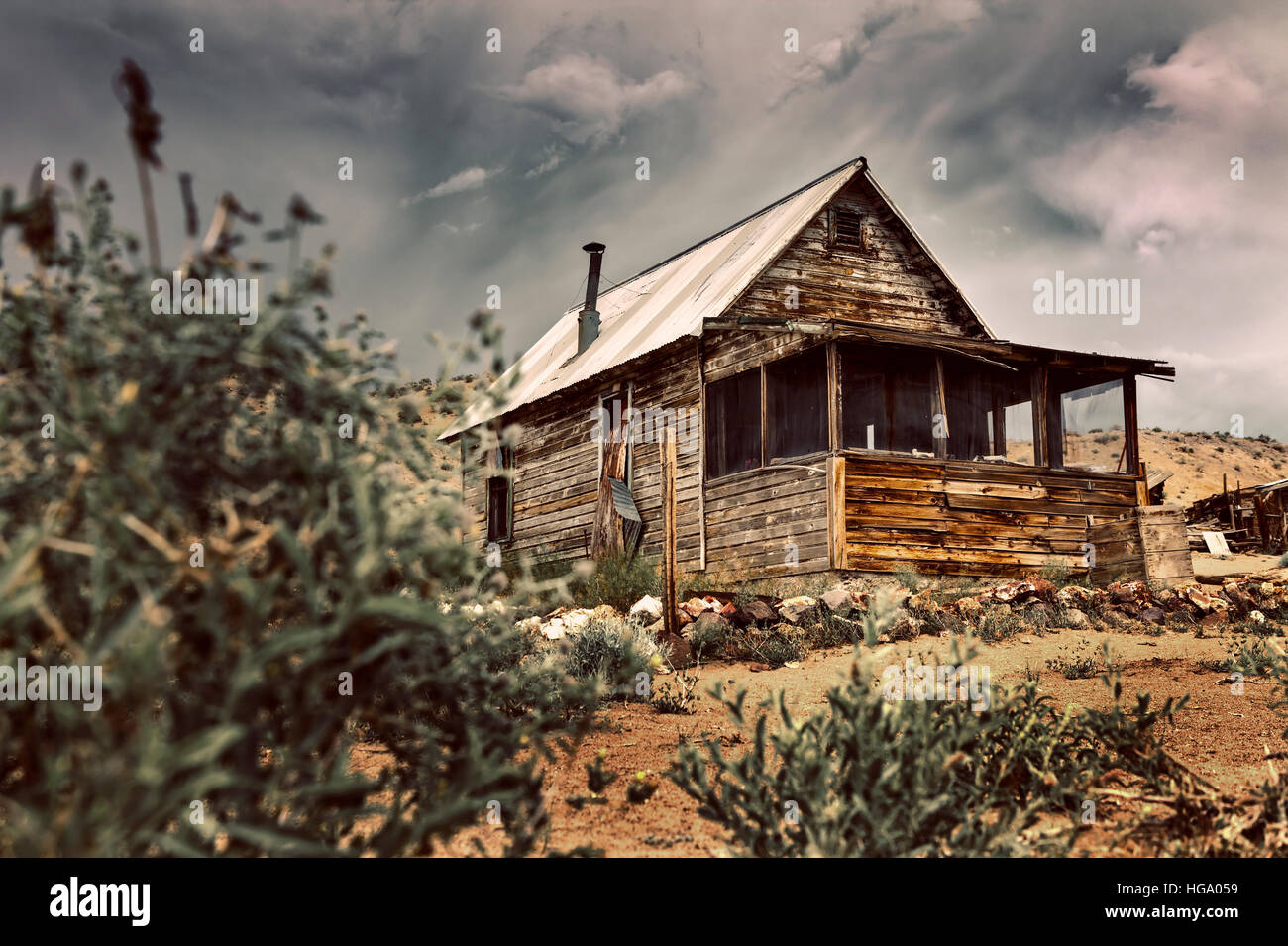Old Ghost Town Cabin in the Nevada Desert. Image has a vintage color ...