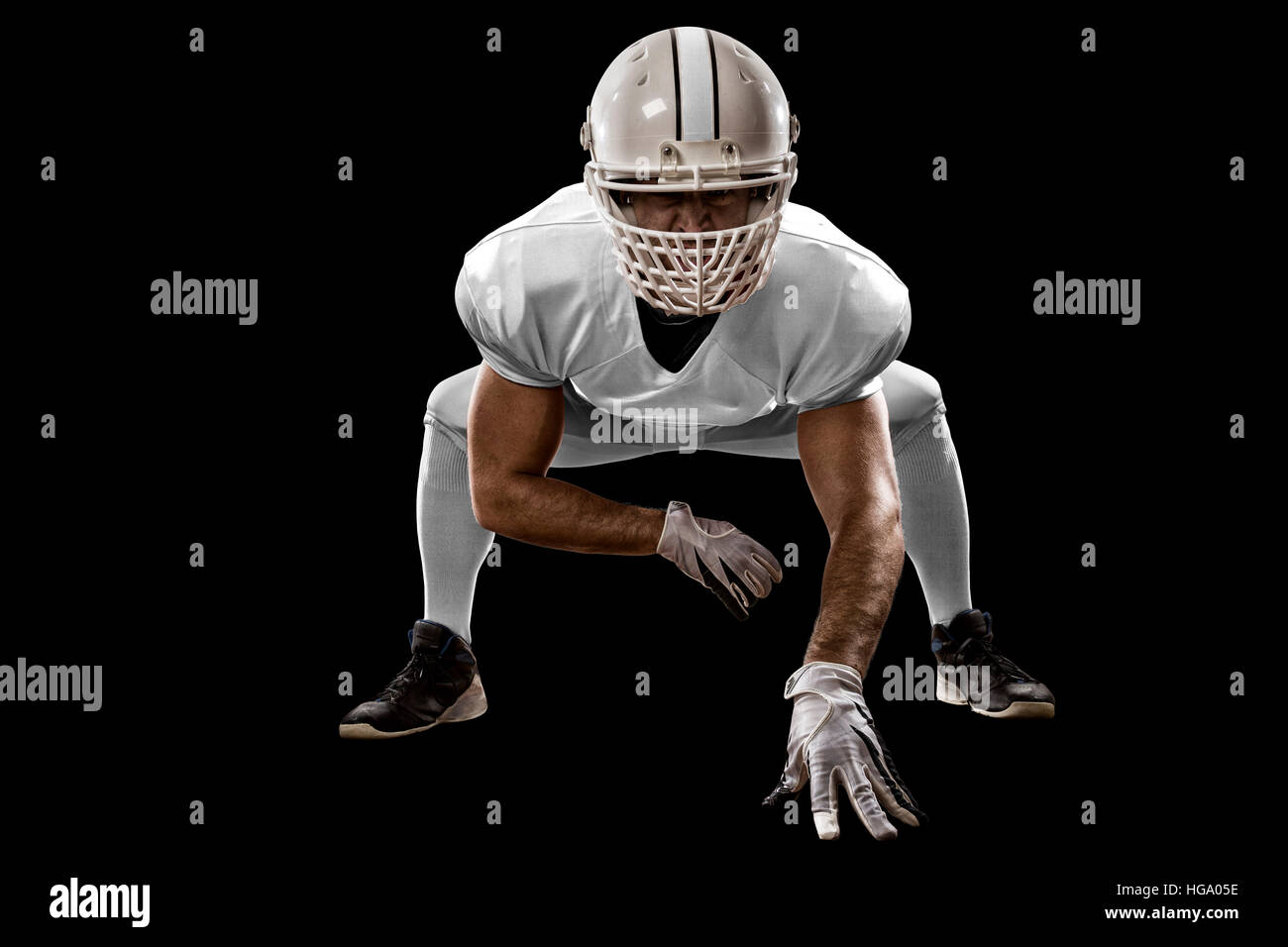 Football Player with a white uniform on the scrimmage line, on a black ...