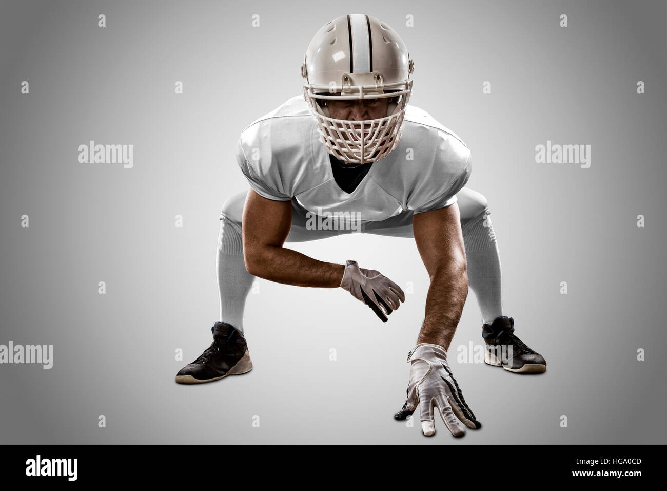 Football Player with a white uniform on the scrimmage line, on a white ...