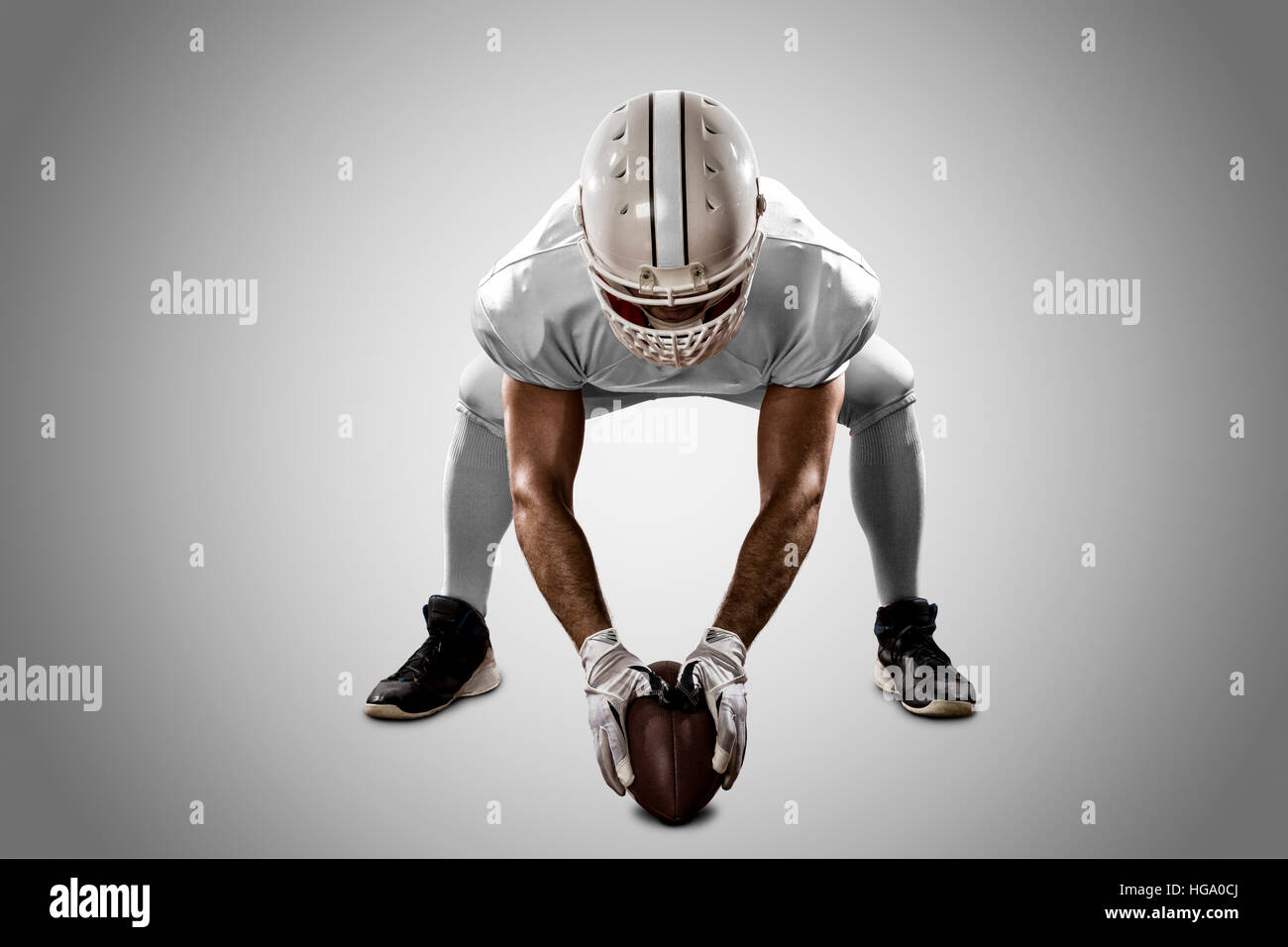 Football Player with a white uniform on the scrimmage line, on a white ...
