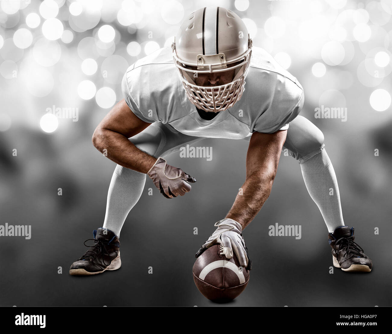 Football Player with a white uniform on the scrimmage line, on a white ...