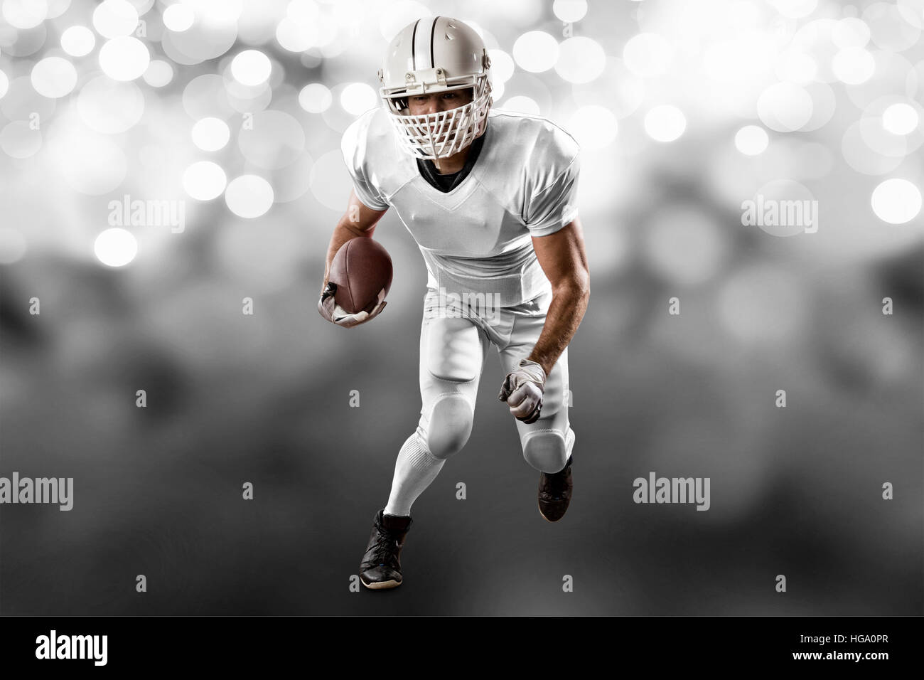 Football Player with a white uniform Running on a white lights ...