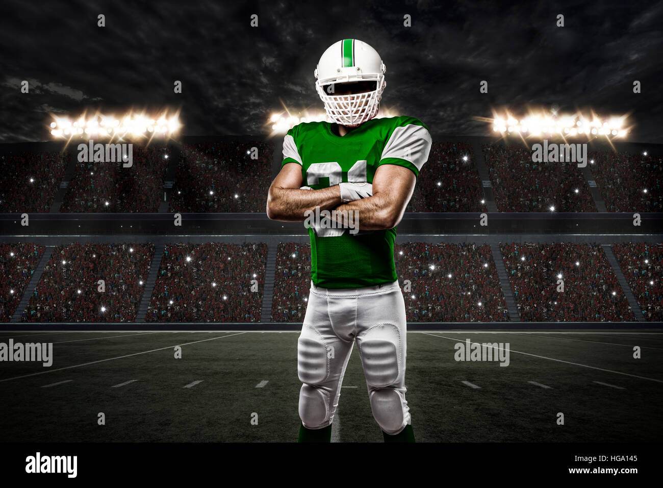 Football Player with a green uniform on a stadium Stock Photo - Alamy