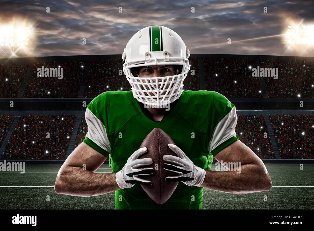 Football Player with a green uniform on a stadium Stock Photo - Alamy
