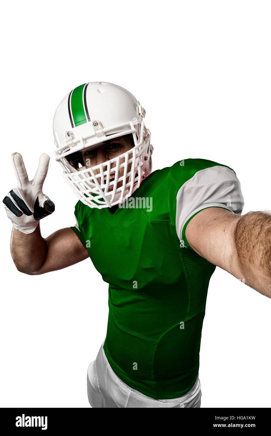 Football Player with a Green uniform making a selfie on a white ...