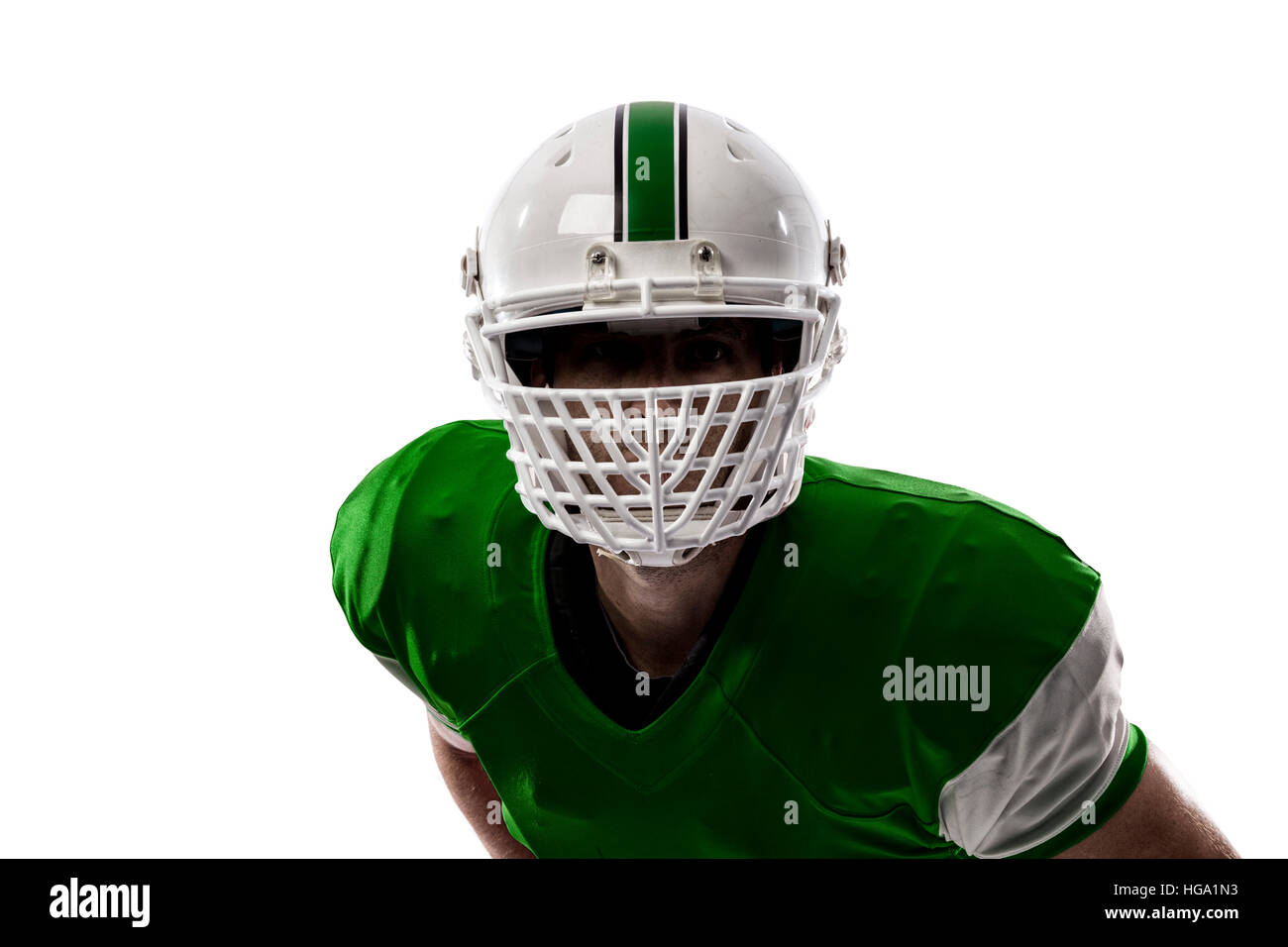Close up of a Football Player with a Green uniform on a white ...
