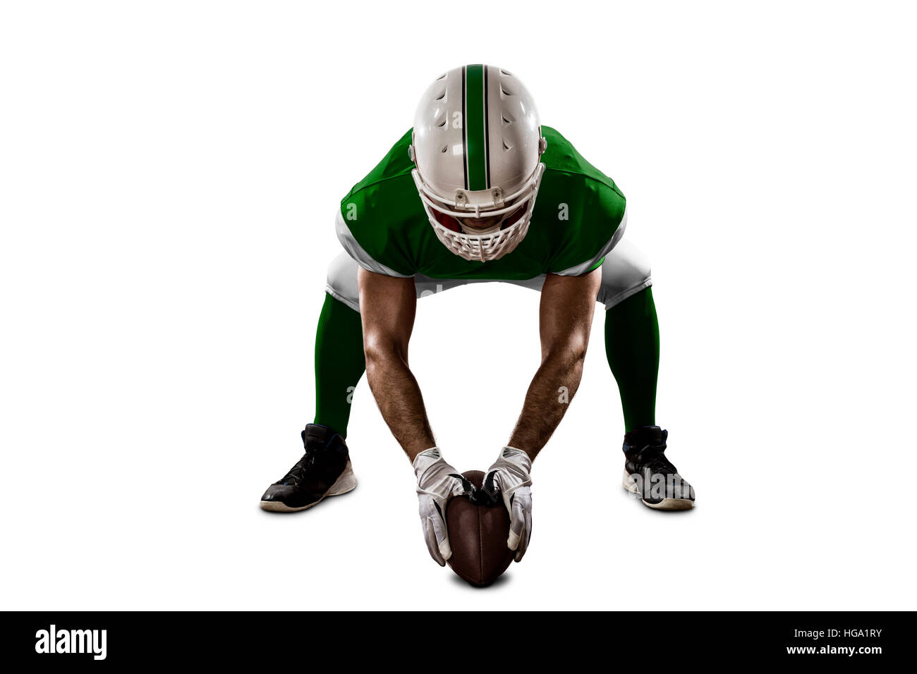Football Player with a Green uniform on the scrimmage line, on a white ...