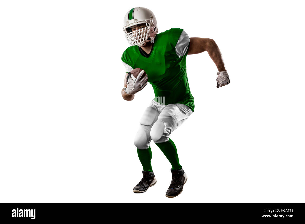 Football Player with a Green uniform Running on a white background ...