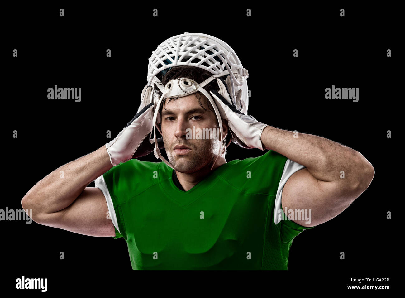 Football Player with a Green uniform on a black background Stock Photo ...