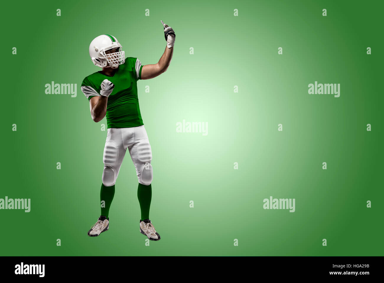 Football Player with a green uniform making a selfie on a green ...