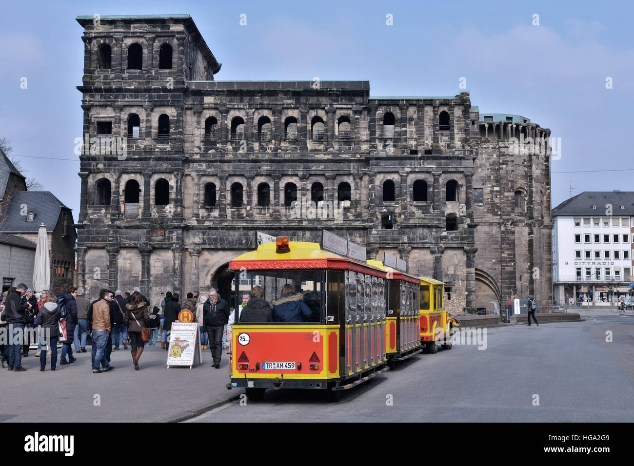 TRIER, GERMANY-MARCH 14, 2015: Tourists wait for a tourist train near ...