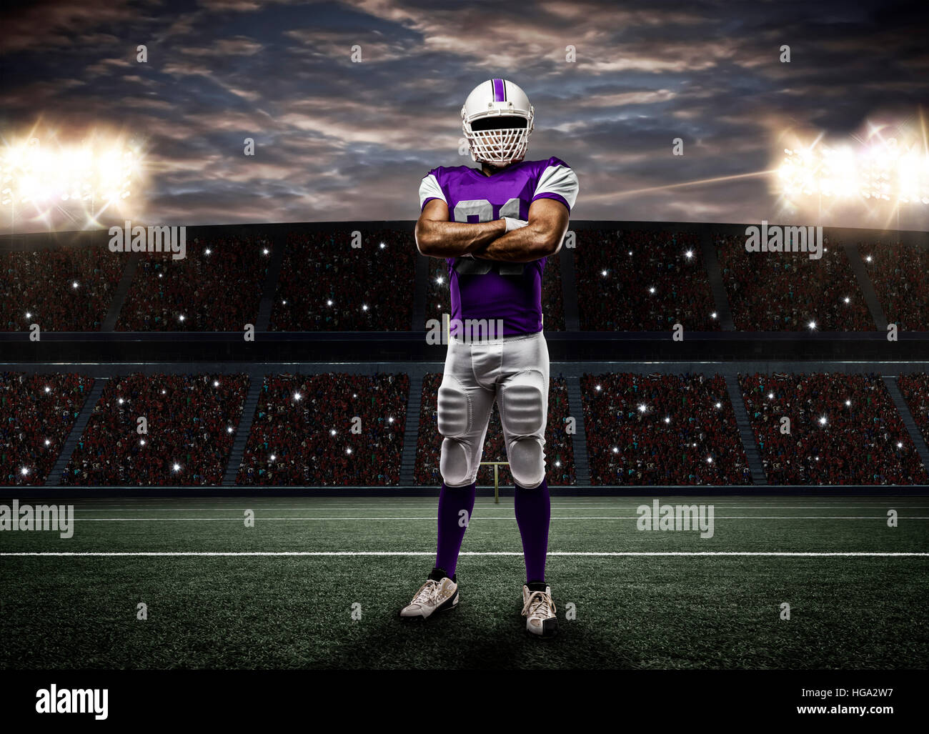 Football Player with a purple uniform on a stadium Stock Photo - Alamy