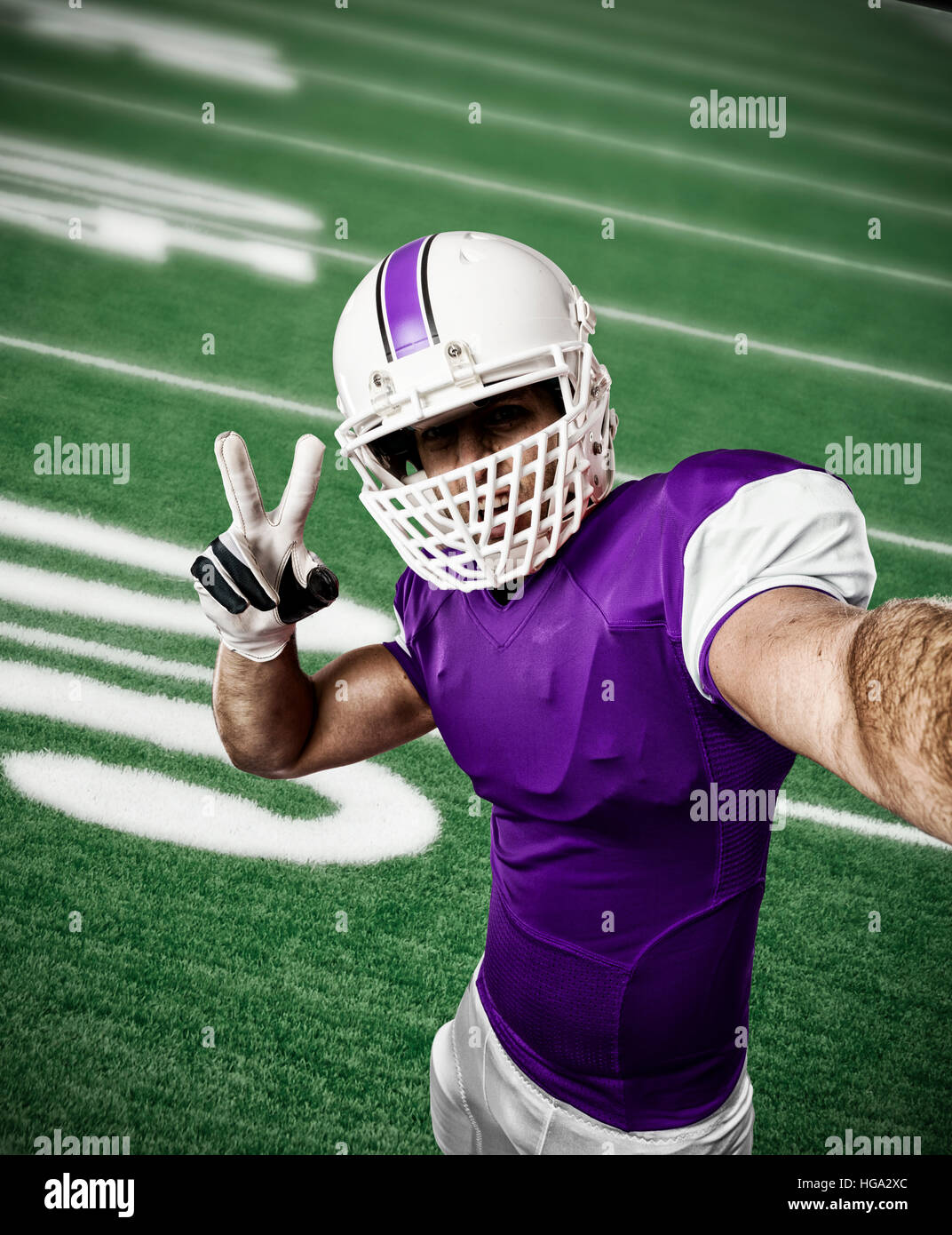 Football Player with a purple uniform making a selfie on a football ...
