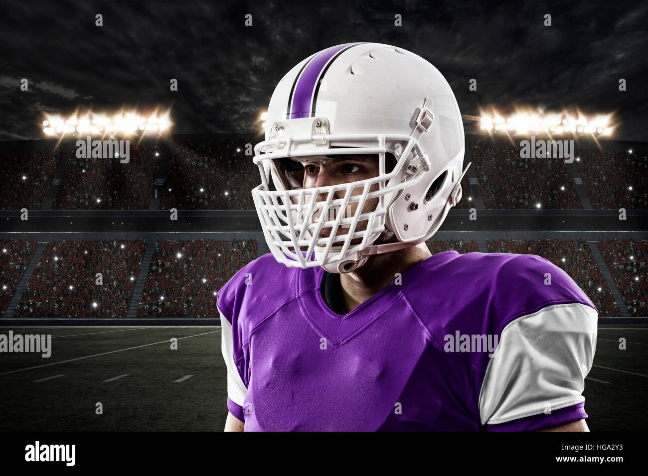Close up of a Football purple with a white uniform on a stadium Stock ...