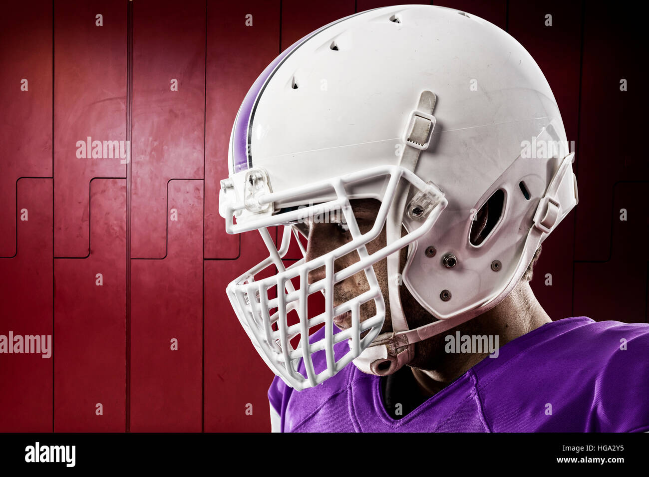 Football Player with a purple uniform on a Locker roon Stock Photo - Alamy