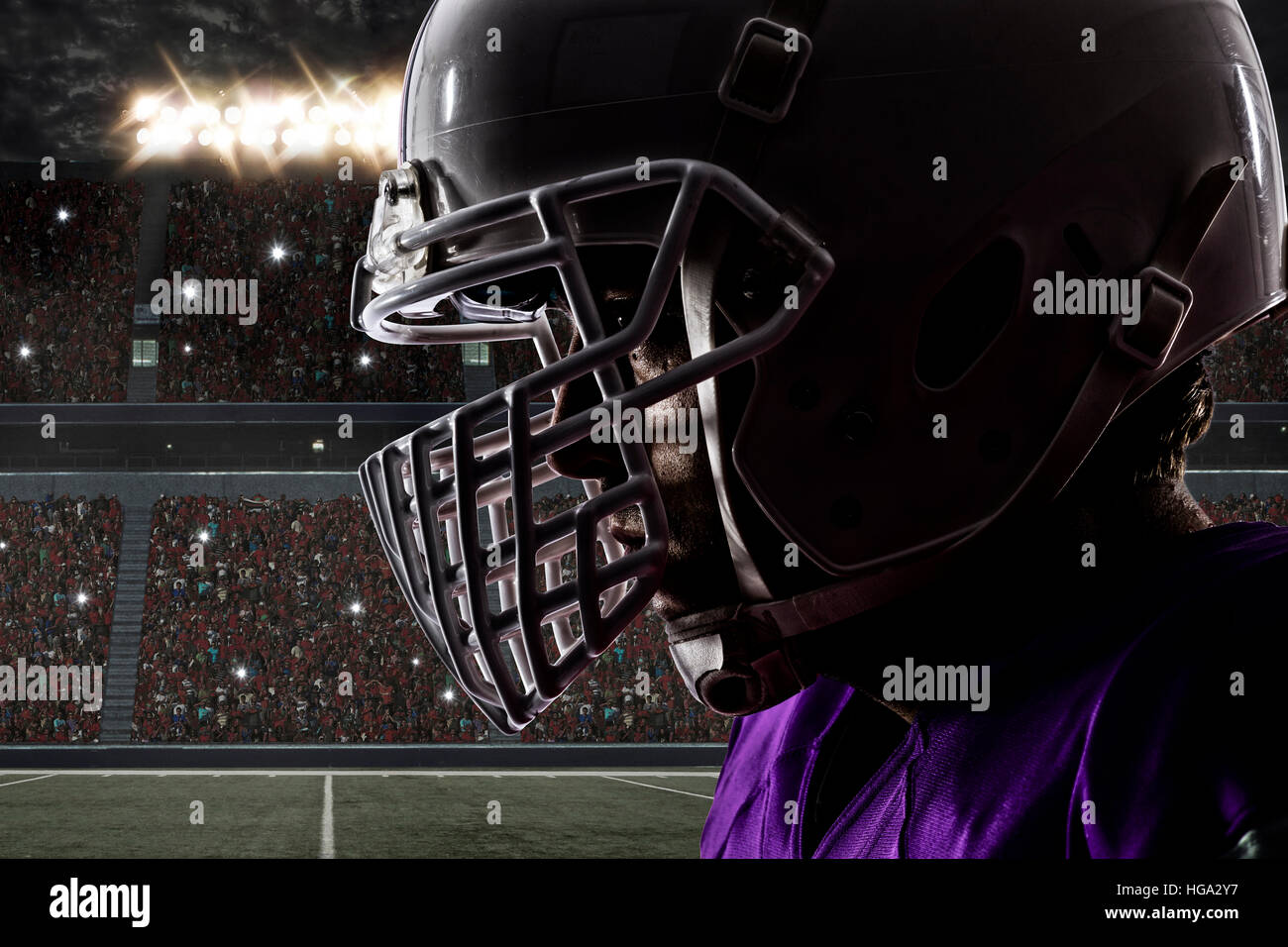 Close up of a Football purple with a white uniform on a stadium Stock ...