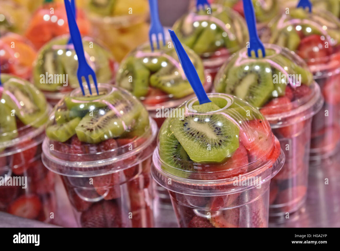 Fruit salad in plastic glasses in outdoors cafe Stock Photo - Alamy