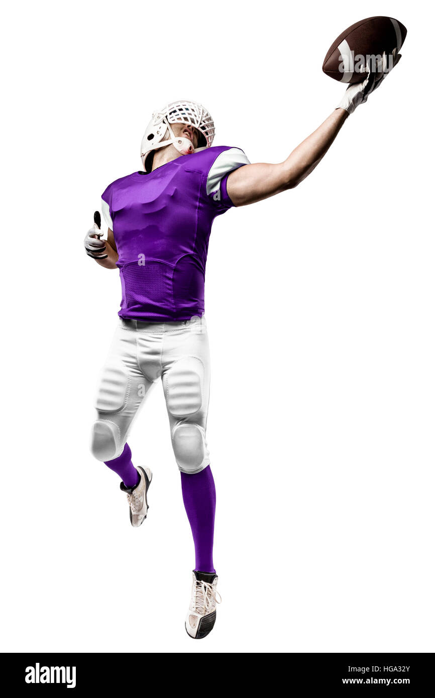 Football Player with a purple uniform making a catching on a white ...