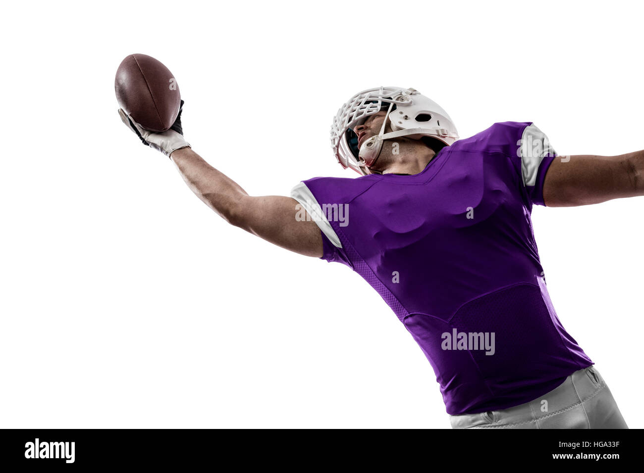 Football Player with a purple uniform making a catching on a white ...