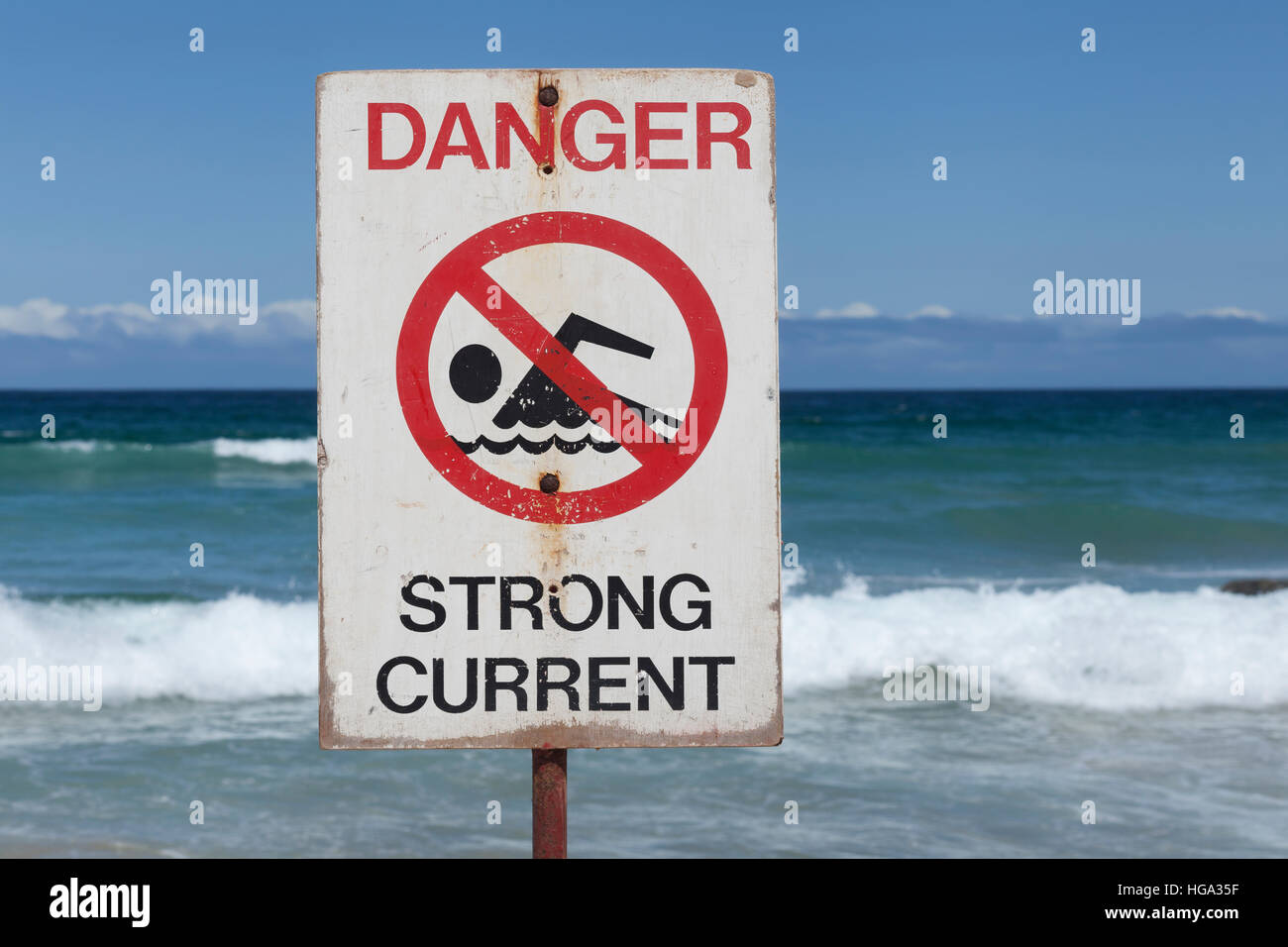 Dangerous currents sign at Bondi Beach in Sydney, Australia. On a sunny ...
