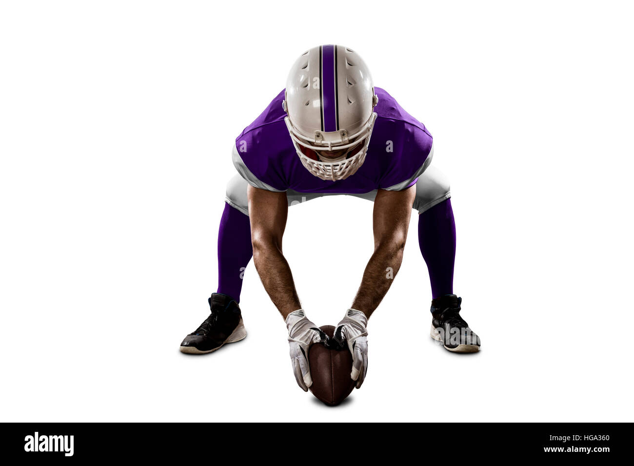 Football Player with a purple uniform on the scrimmage line, on a white ...